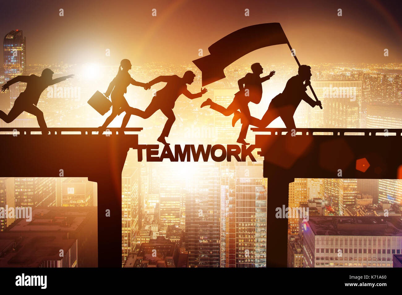Teamwork concept with business people crossing bridge Stock Photo - Alamy