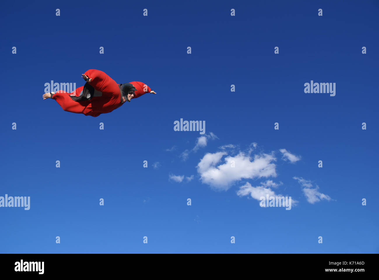Red flying suit hi-res stock photography and images - Alamy