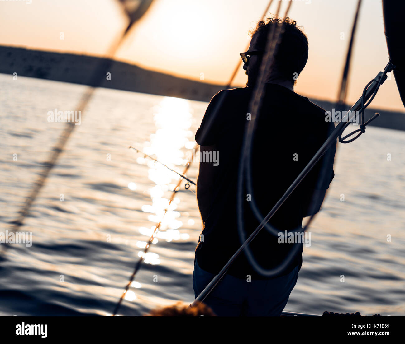 Fishing on calm waters Stock Photo - Alamy