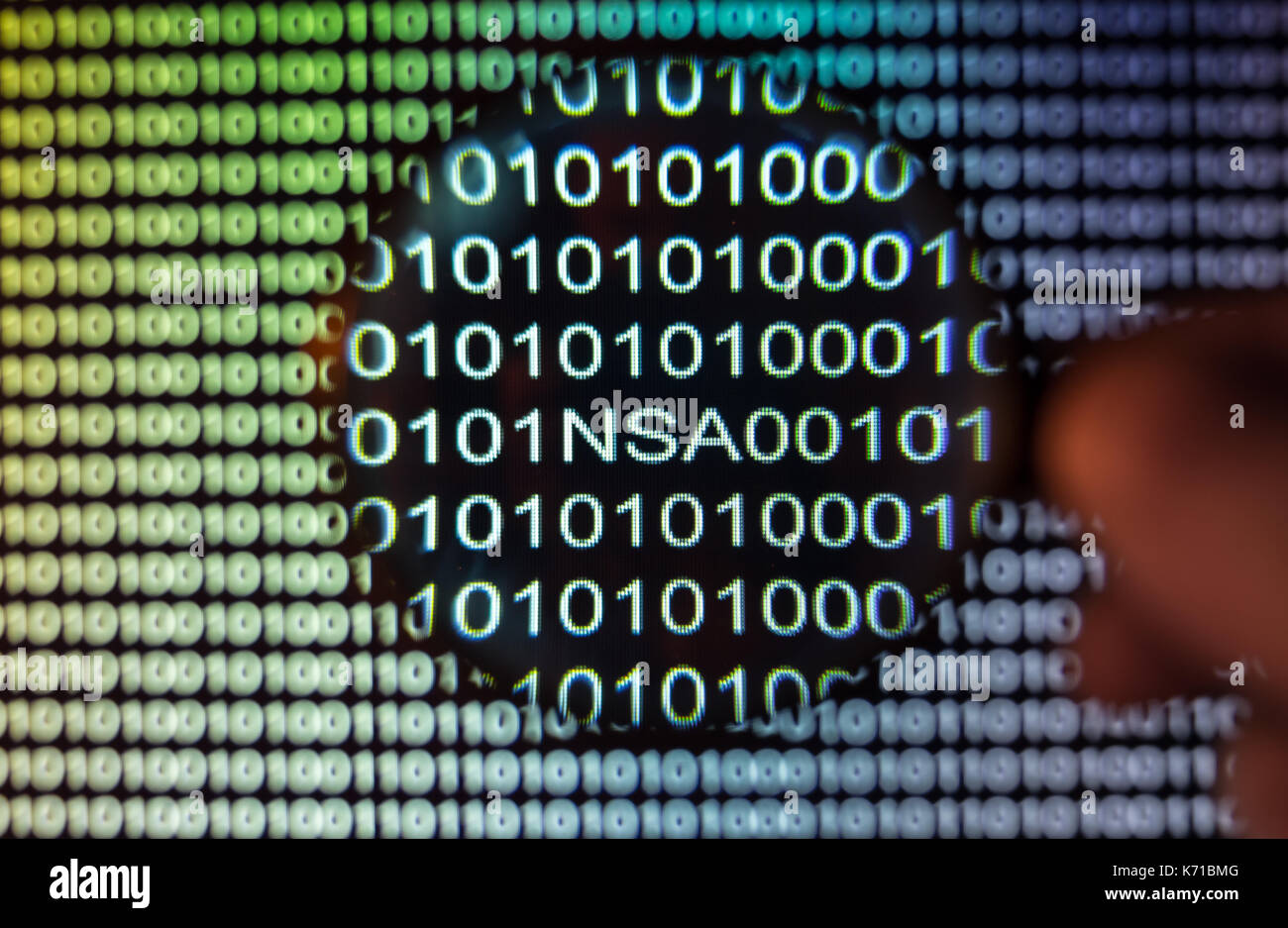 Binary Code, Magnifying glass shows american intelligence agency NSA ...