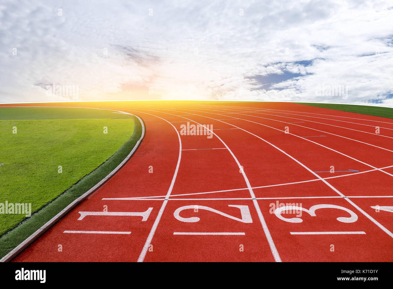 field run in stadium Red running with lanes over sky Stock Photo - Alamy