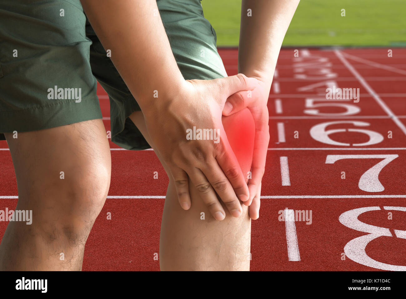 the knee man holds on suffering from pain in knee Closeup. The lesion ...