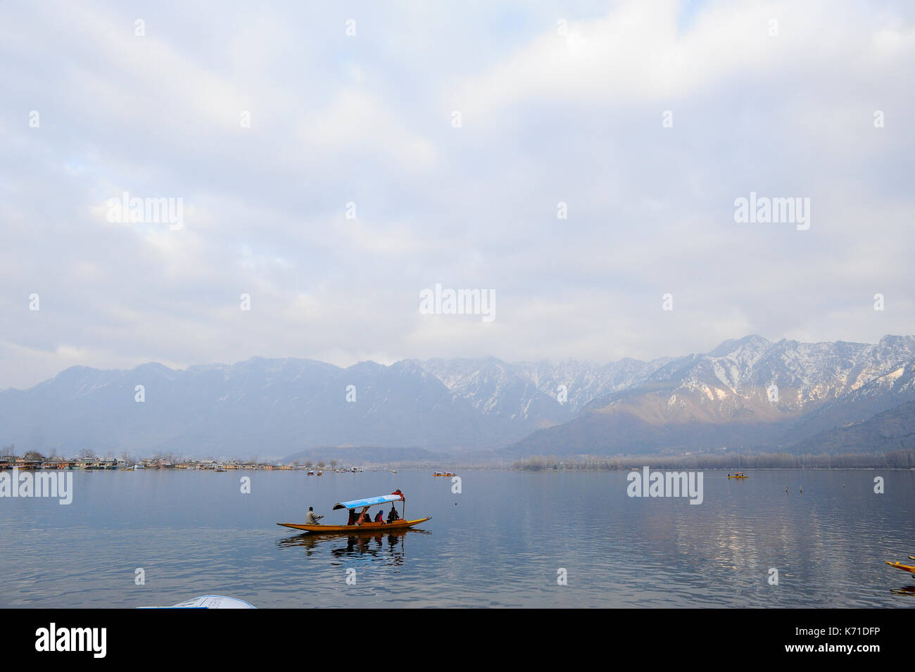 Beautiful boat calle "Shikara" at Dal Lake Kashmir India during winter ...