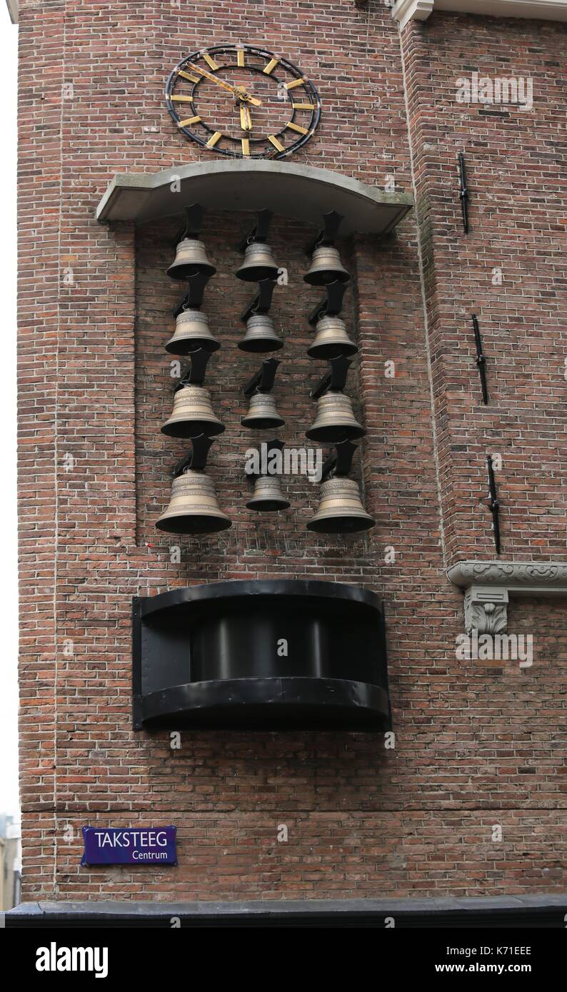 Amsterdam ancient clock tower with many bells in the street called ...