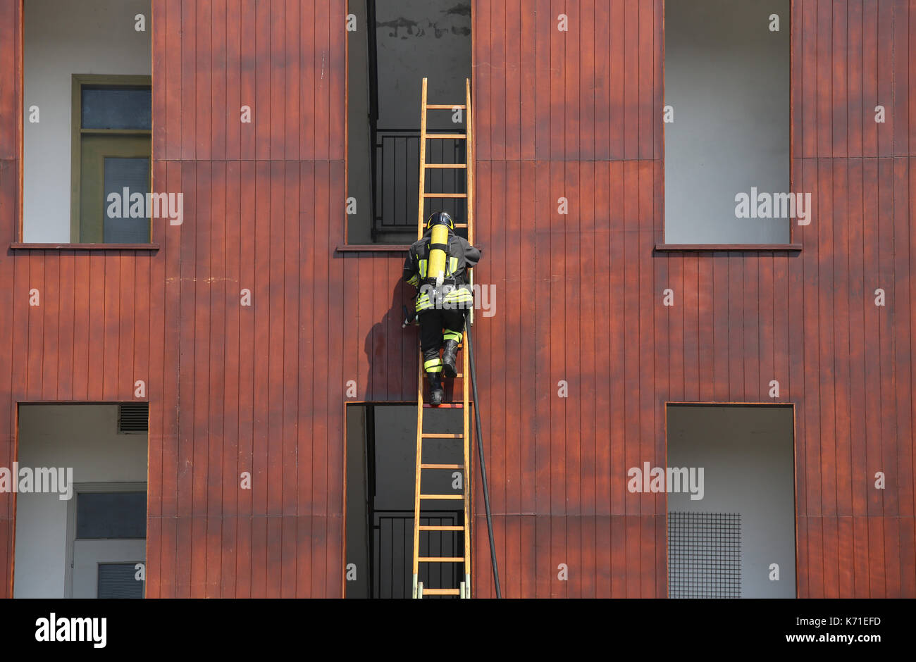 firefighter exercise while climbing in the fire station building Stock ...