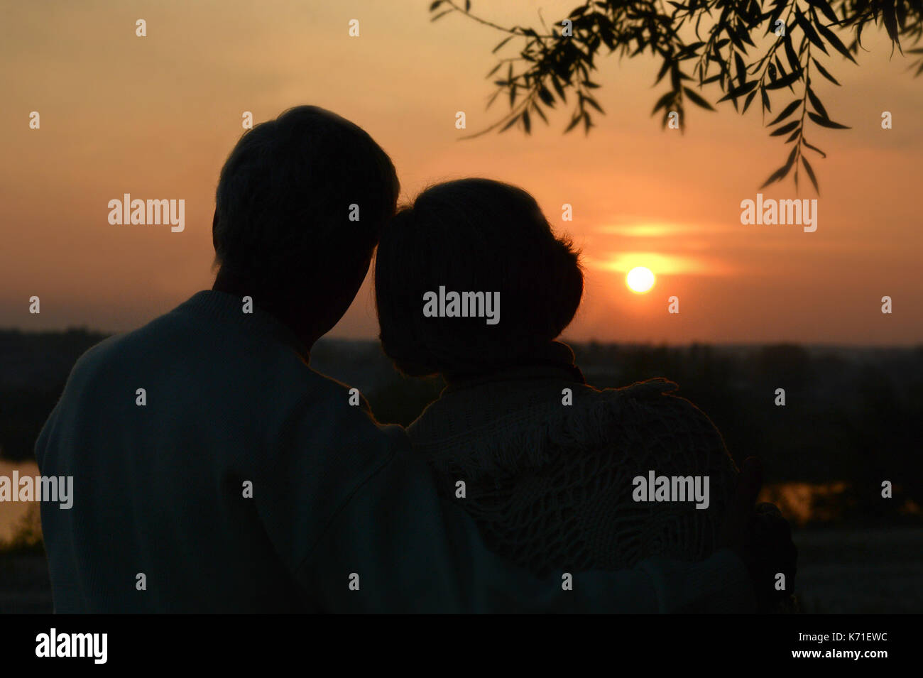 elderly couple hugging Stock Photo - Alamy