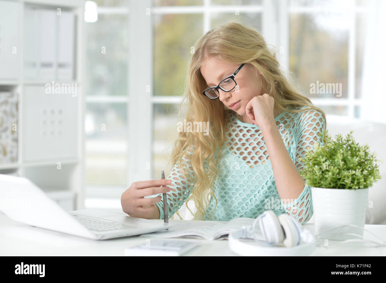 cute teen girl doing homework Stock Photo - Alamy
