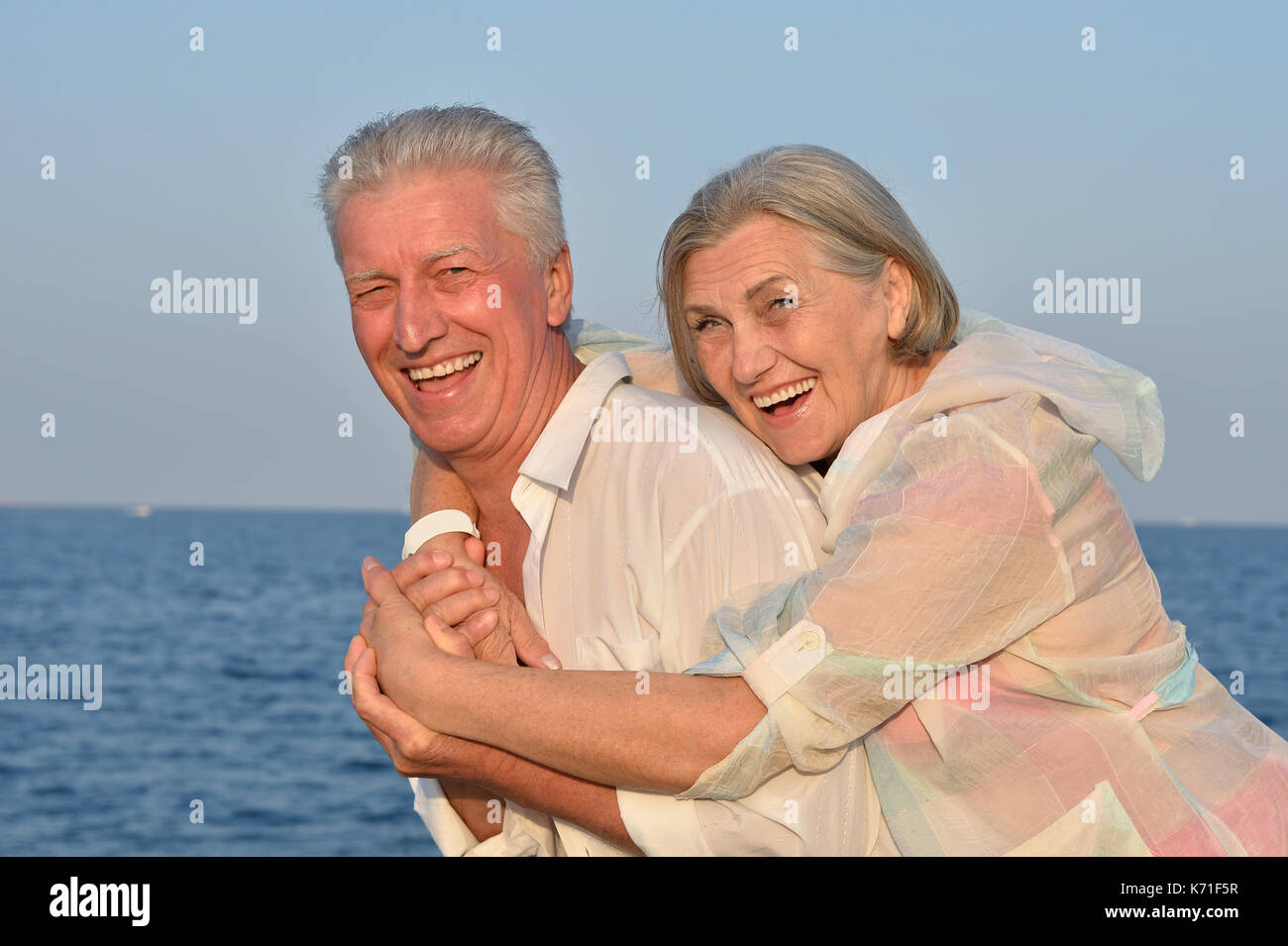 elderly couple rest at tropical resort Stock Photo - Alamy