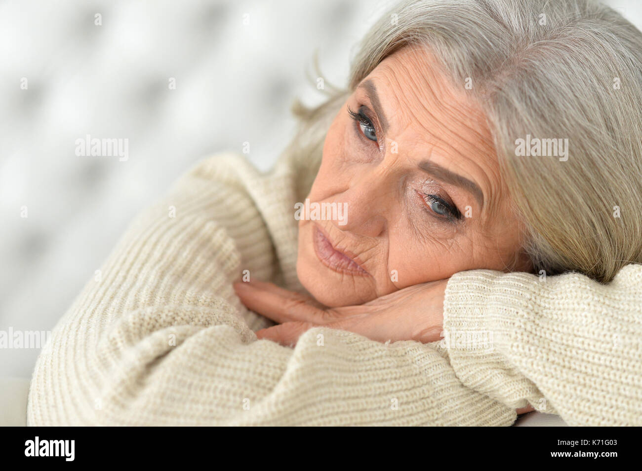 Sad senior woman Stock Photo - Alamy
