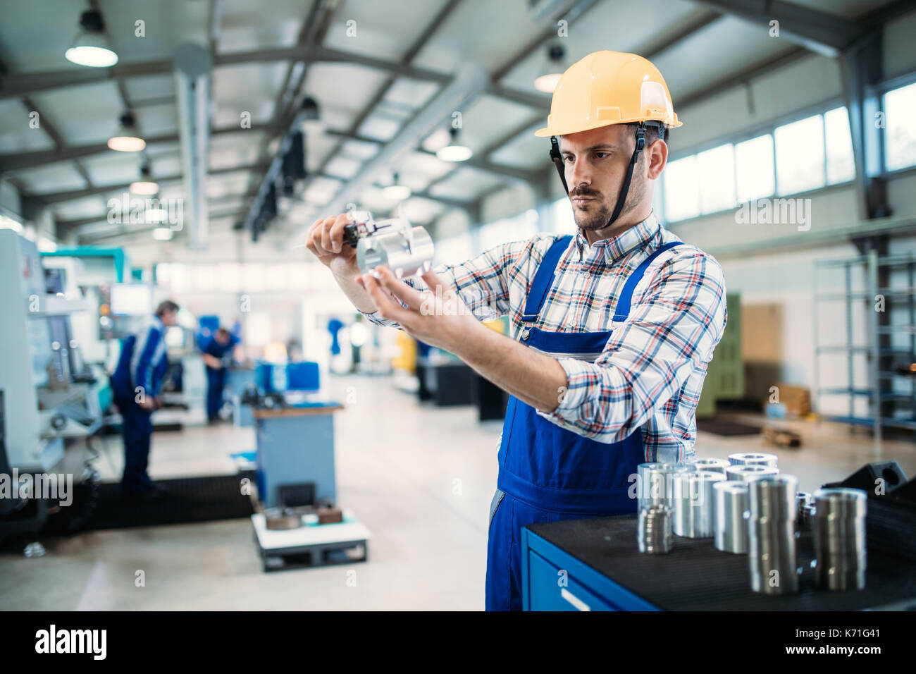 modern industrial machine operator working in factory Stock Photo - Alamy