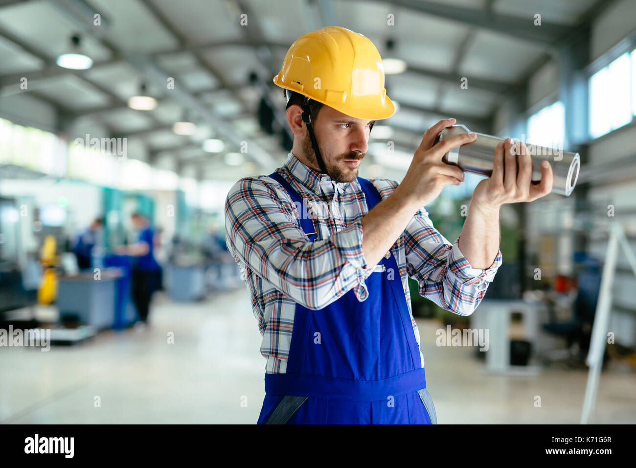 modern industrial machine operator working in factory Stock Photo - Alamy