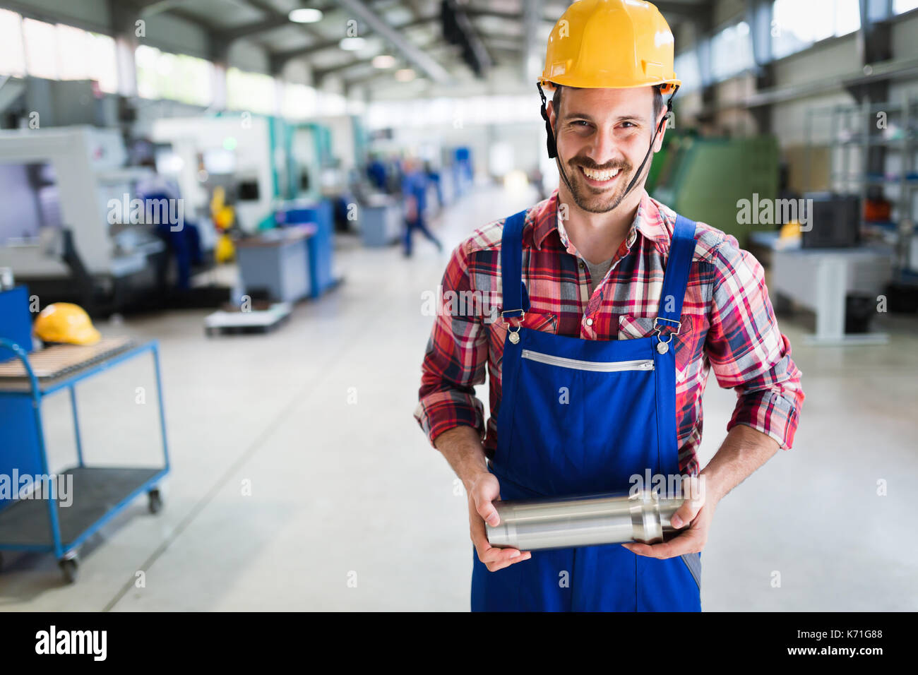 Portrait of an metal engineer working at factory Stock Photo - Alamy