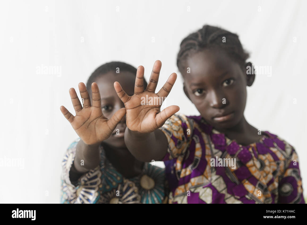 Child holding stop sign african hi-res stock photography and images - Alamy