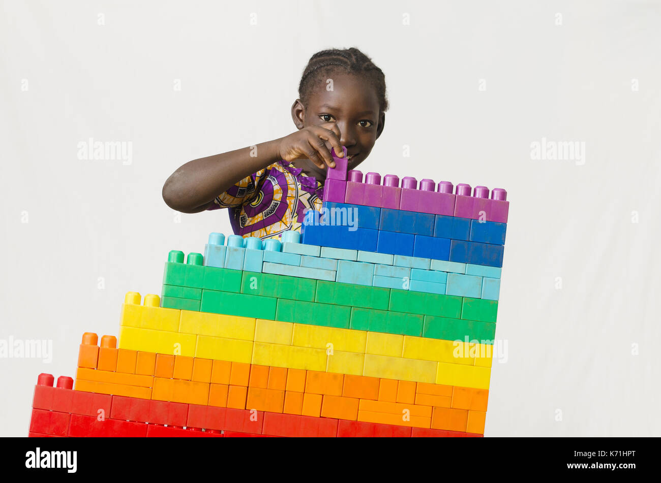 Peace symbol - African girl building blocks for a future without war ...