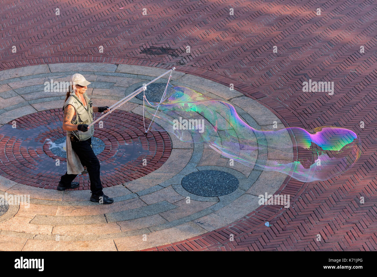 A man performs water bubble trick in Central Park, New York City, New ...