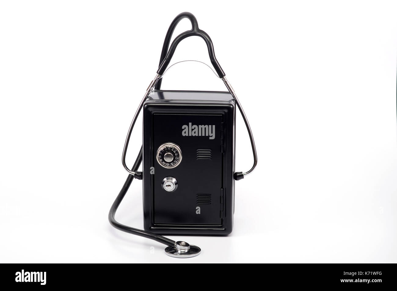 Bank steel safe and Stethoscope isolated, money saving risk concept ...