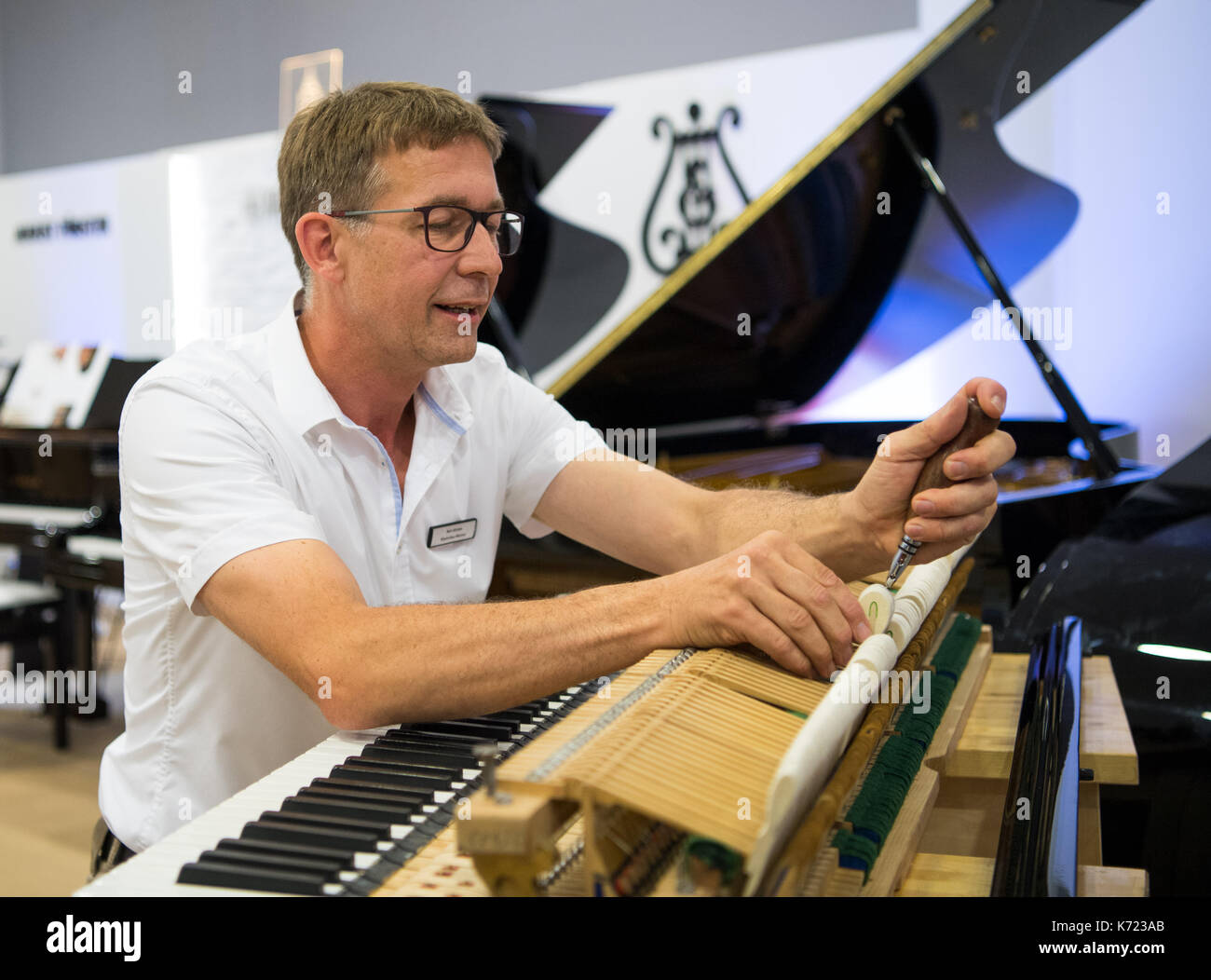 Dresden, Germany. 14th Sep, 2019. Piano maker Bert Kirsten intonates ...