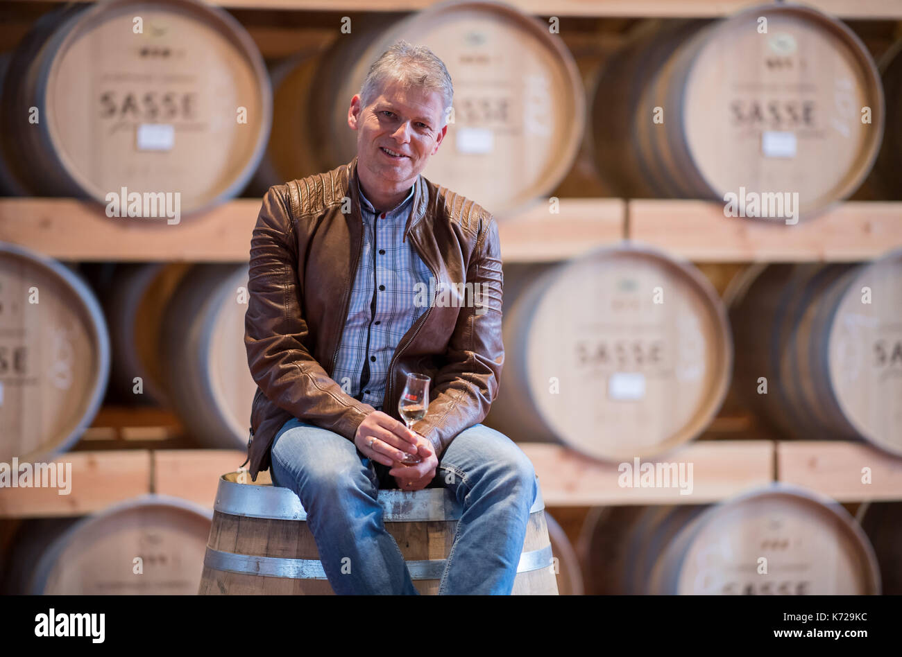 Rüdiger Sasse from the Sasse distillery inspects corn distilled by the ...