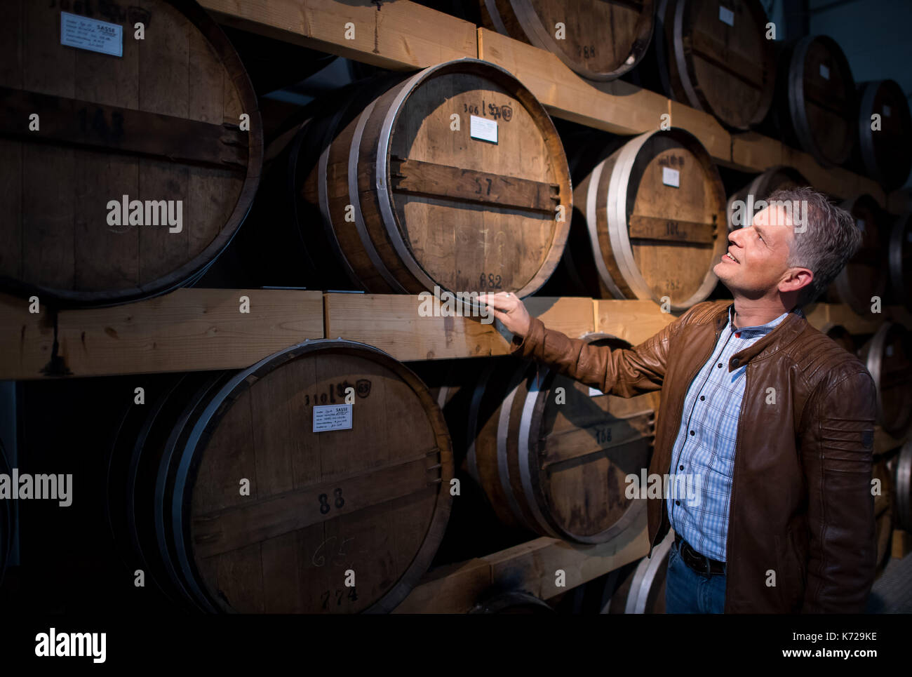 Rüdiger Sasse from the Sasse distillery inspects corn distilled by the ...