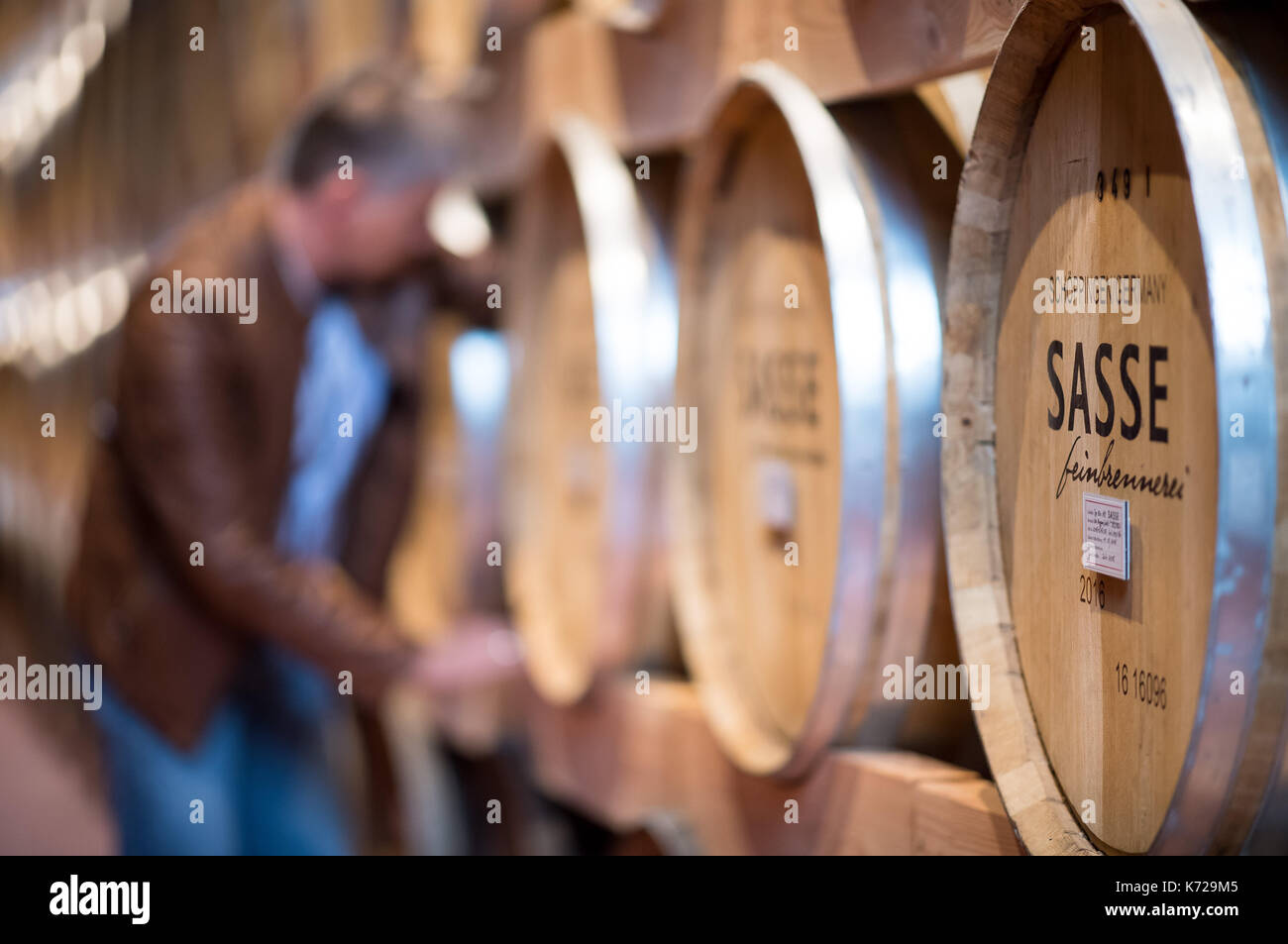 Rüdiger Sasse from the Sasse distillery inspects corn distilled by the ...