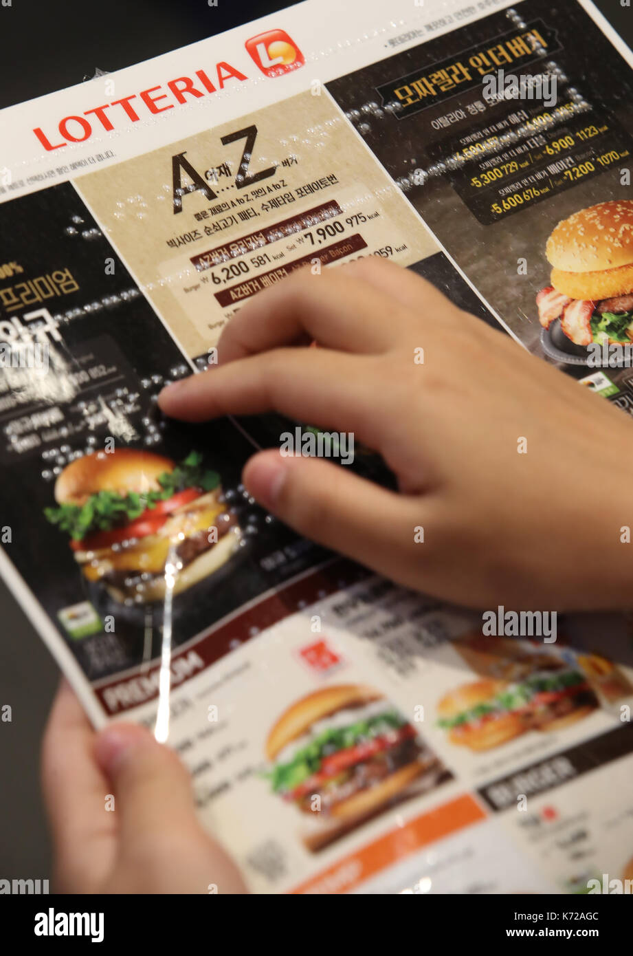 Braille menu at burger franchise A visually impaired customer at a ...