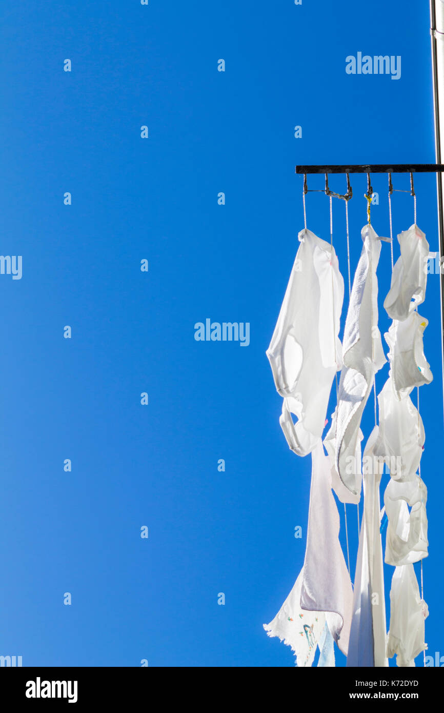 Laundry drying on a rope hi-res stock photography and images - Alamy