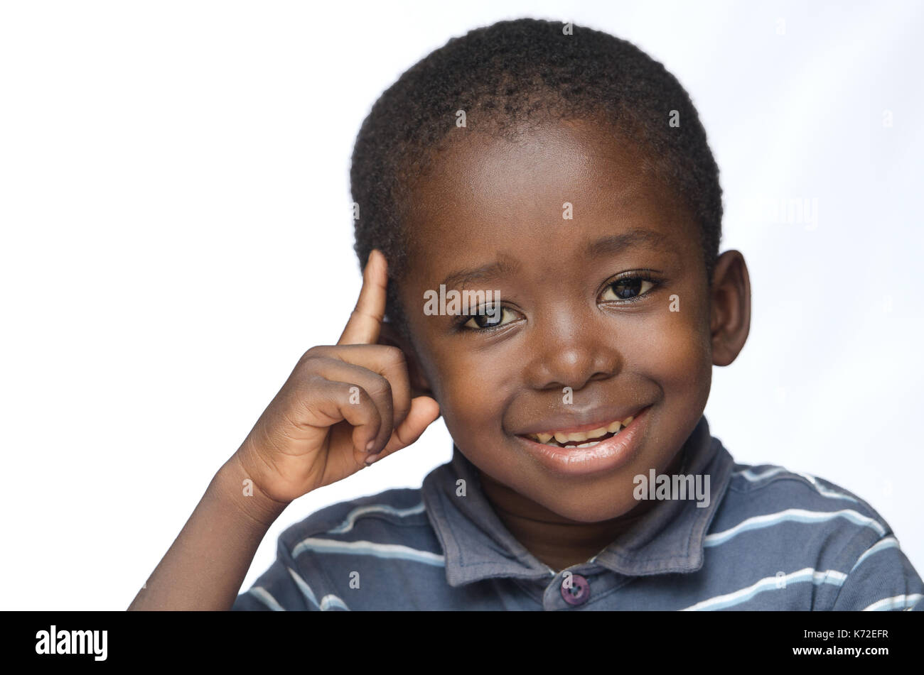 African boy holding his hand out as a STOP sign for racism and abuse ...