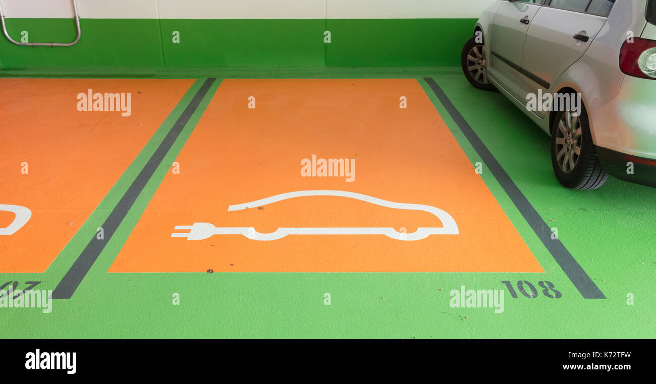 Electric vehicle charging station and parking stall sign paint on ...