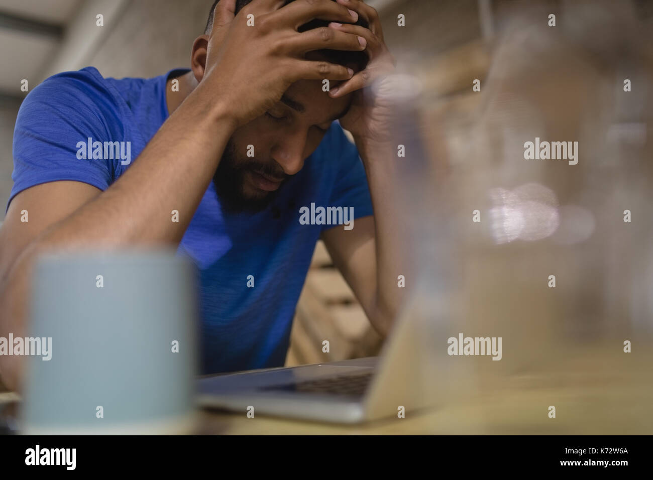 Angry man sitting table in hi-res stock photography and images - Alamy