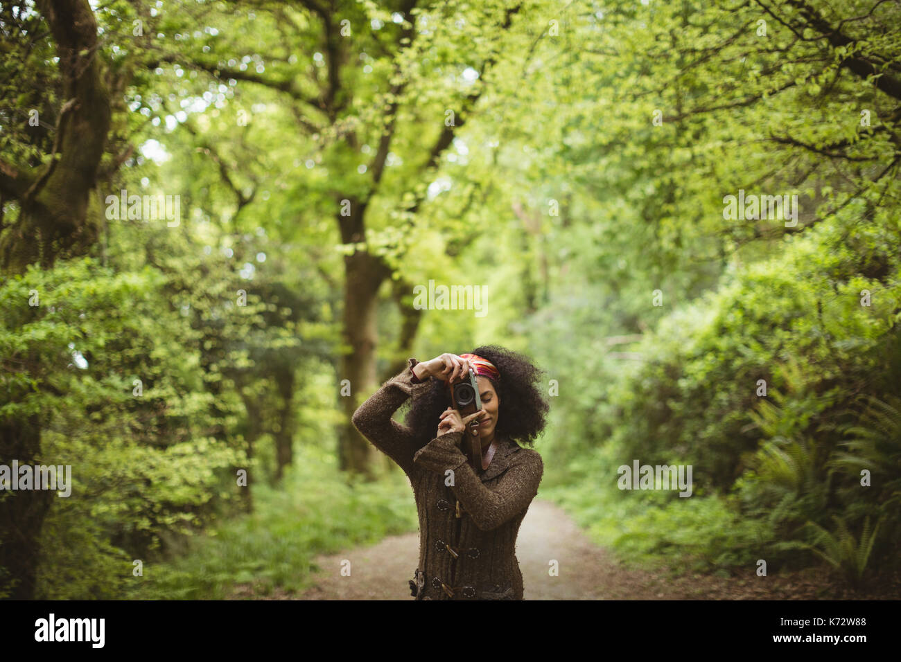 Smiling holding standing camera photographic themes hi-res stock ...