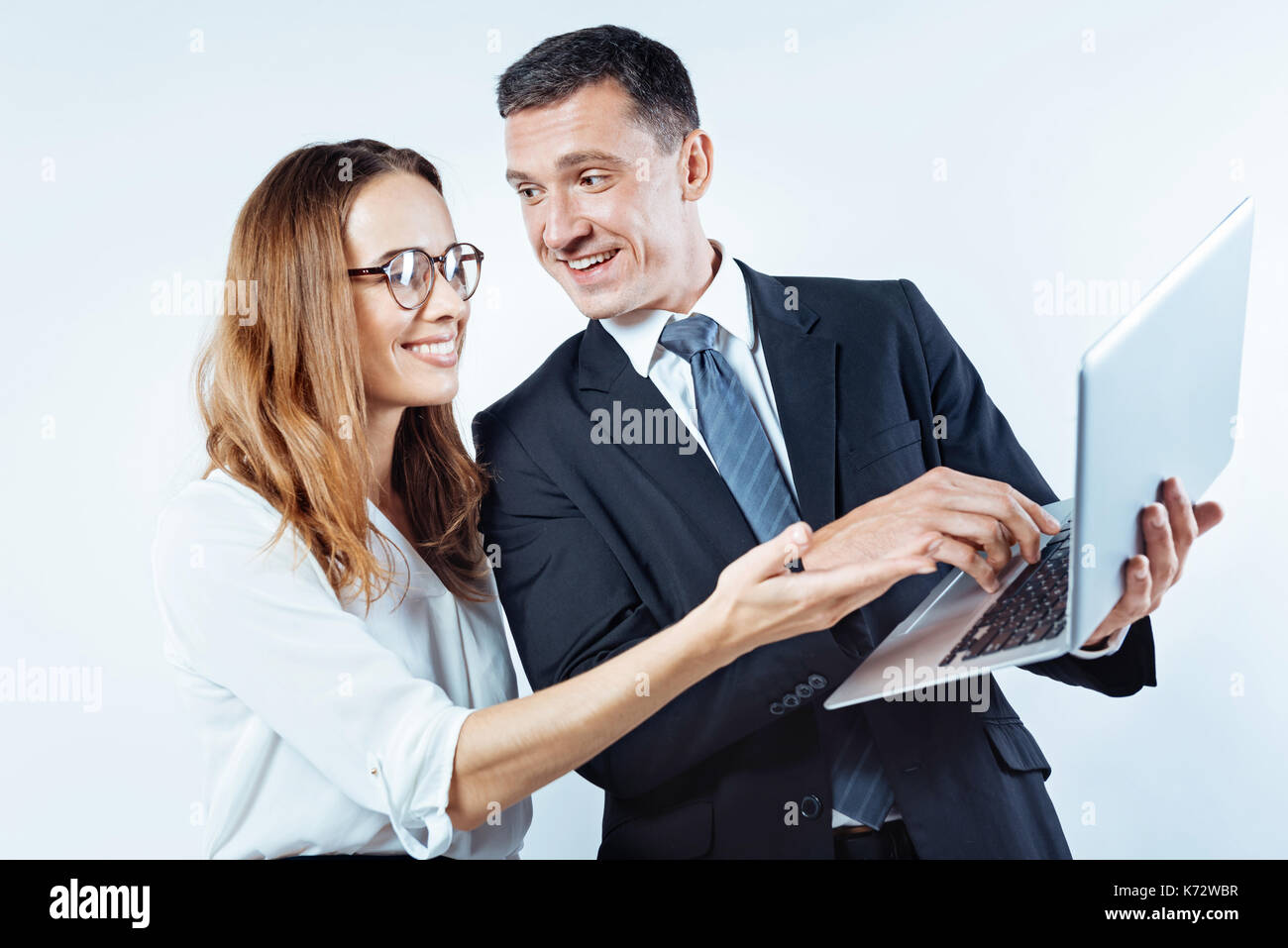 Friendly business people enjoying working together Stock Photo - Alamy