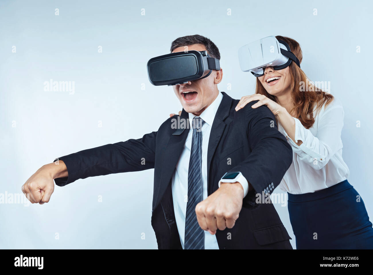 Business colleagues playing visual reality games Stock Photo - Alamy
