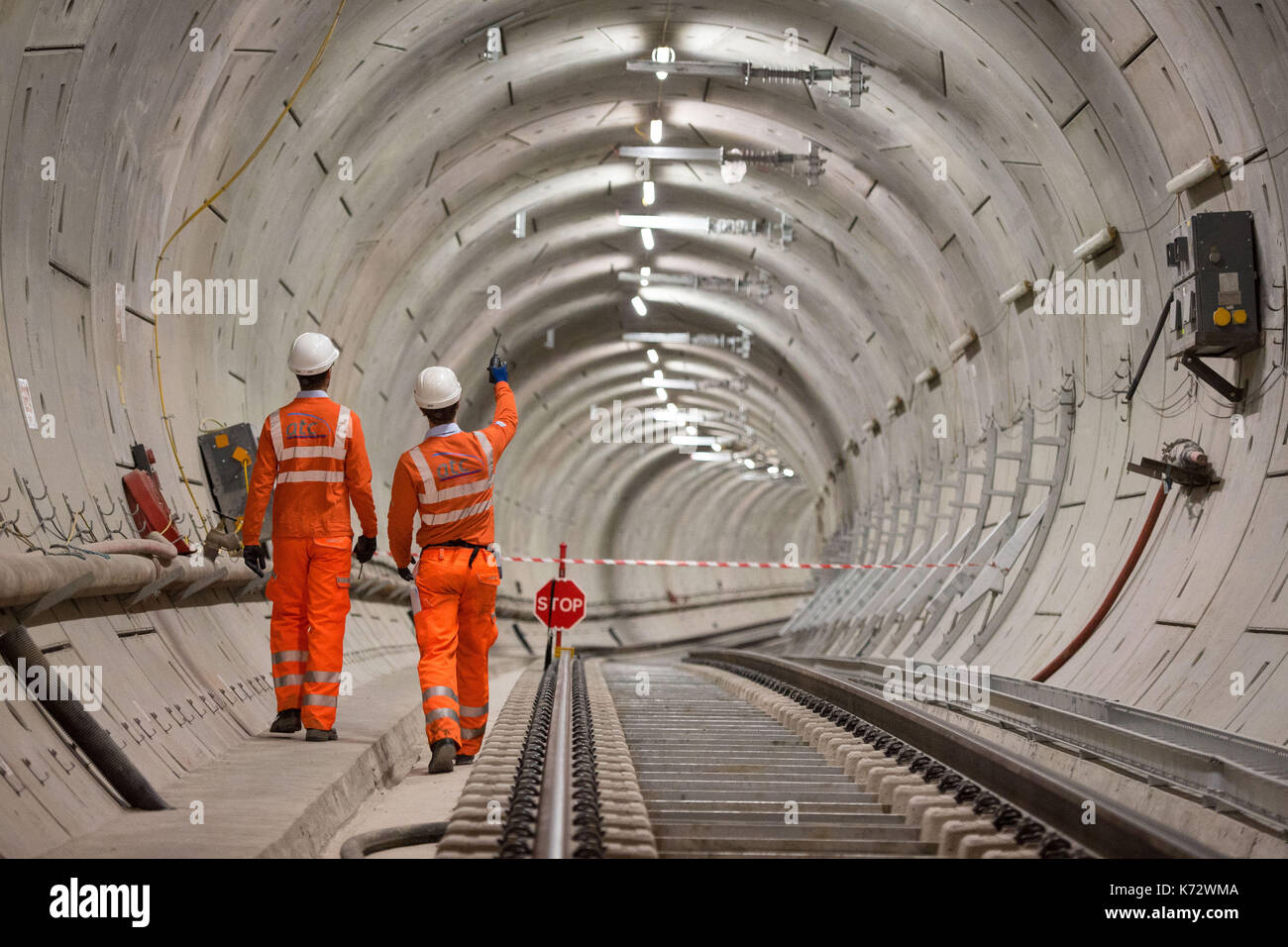 Crossrail engineers walk alongside completed tracks as the Crossrail ...