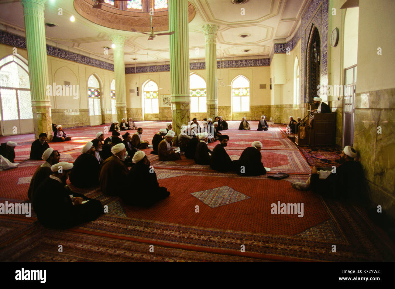 Iranian men praying at a seminary school mosque in Qom Stock Photo - Alamy