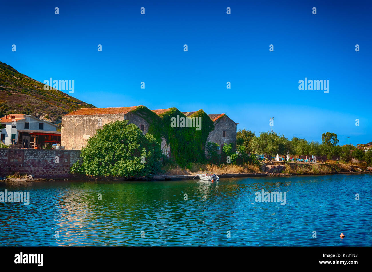 View of ancient village of Bosa on Temo river in a sunny morning of ...