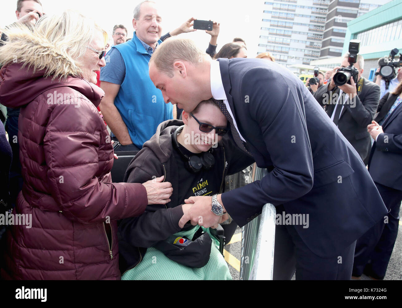 The Duke of Cambridge hugs Katie Daley during his visit to Aintree ...