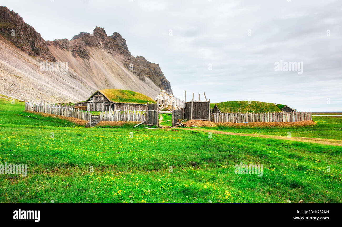 Traditional Viking village. Wooden houses near the mountain first ...