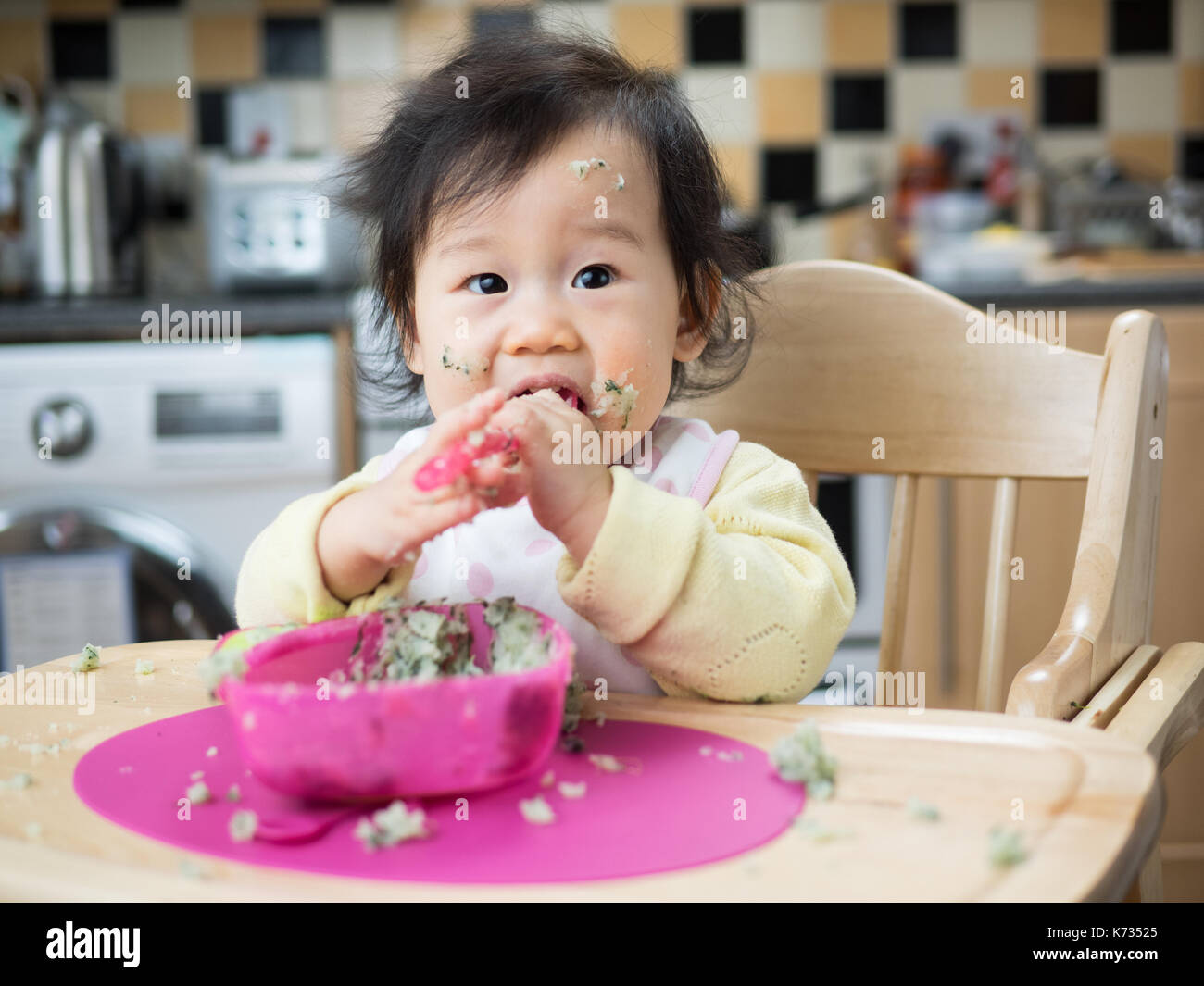 baby eating messy mashed potato Stock Photo - Alamy