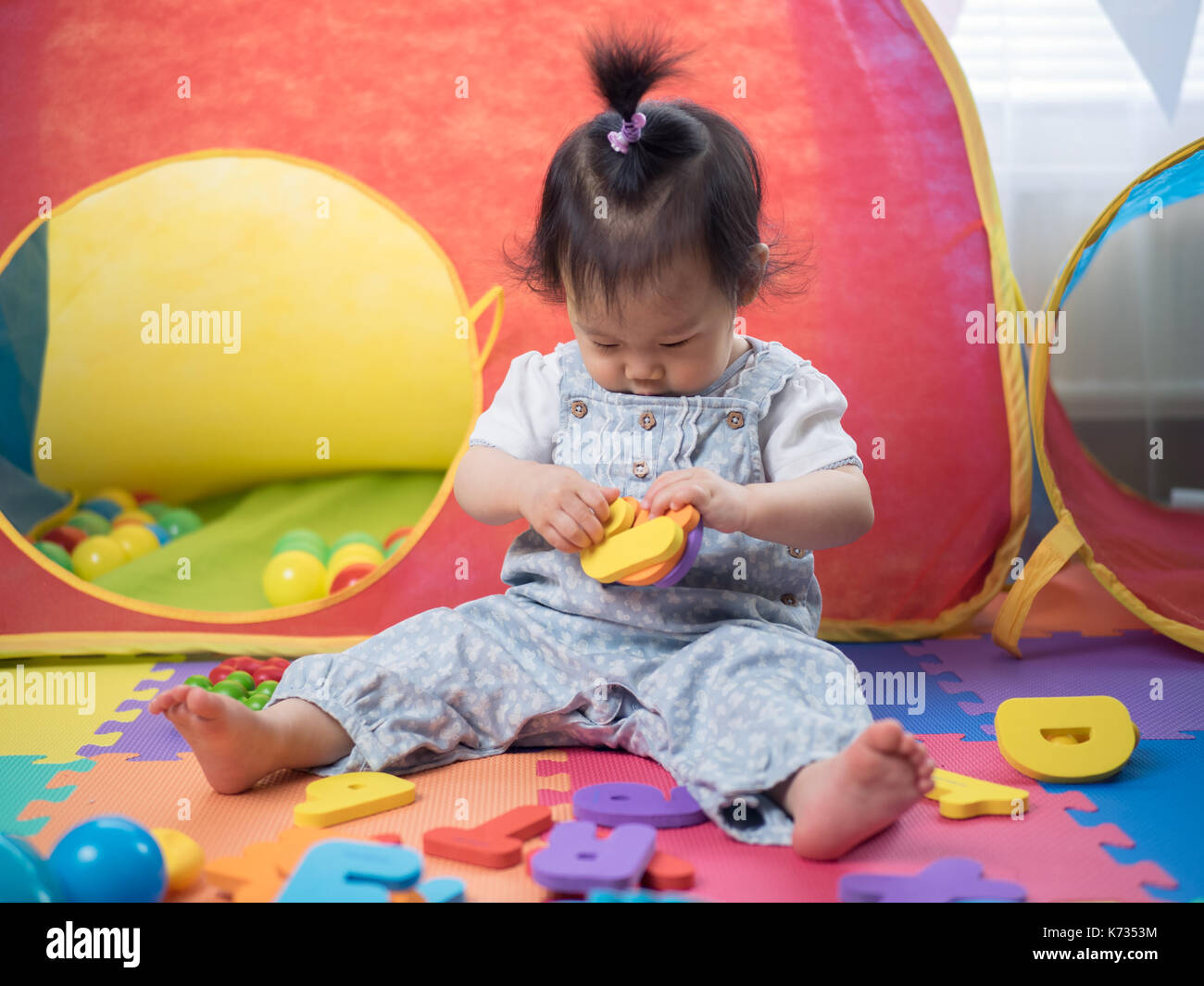 baby girl learning alphabet blocks Stock Photo - Alamy