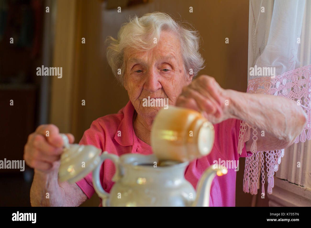 Elderly woman making tea in hi-res stock photography and images - Alamy