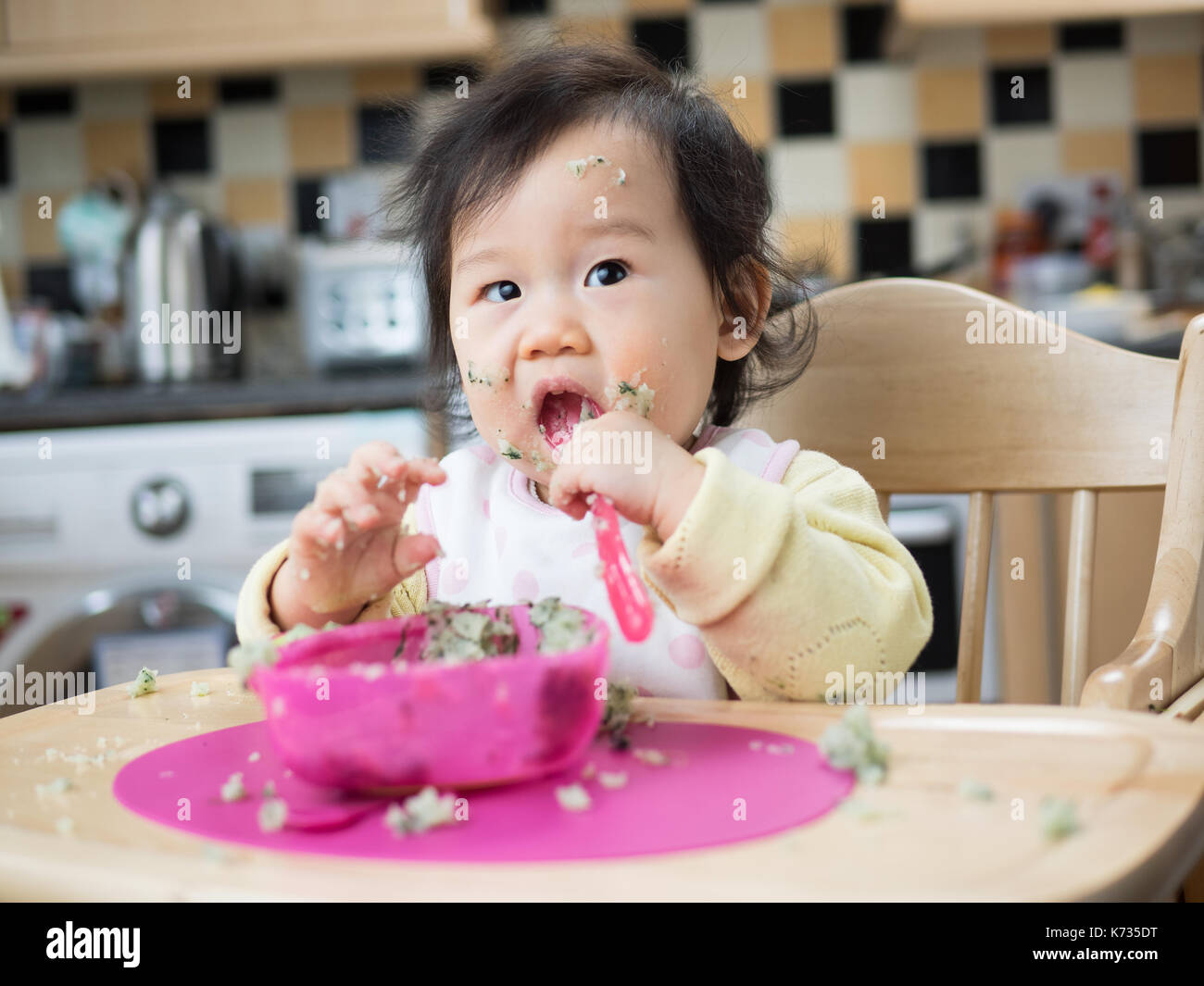 baby eating messy mashed potato Stock Photo - Alamy