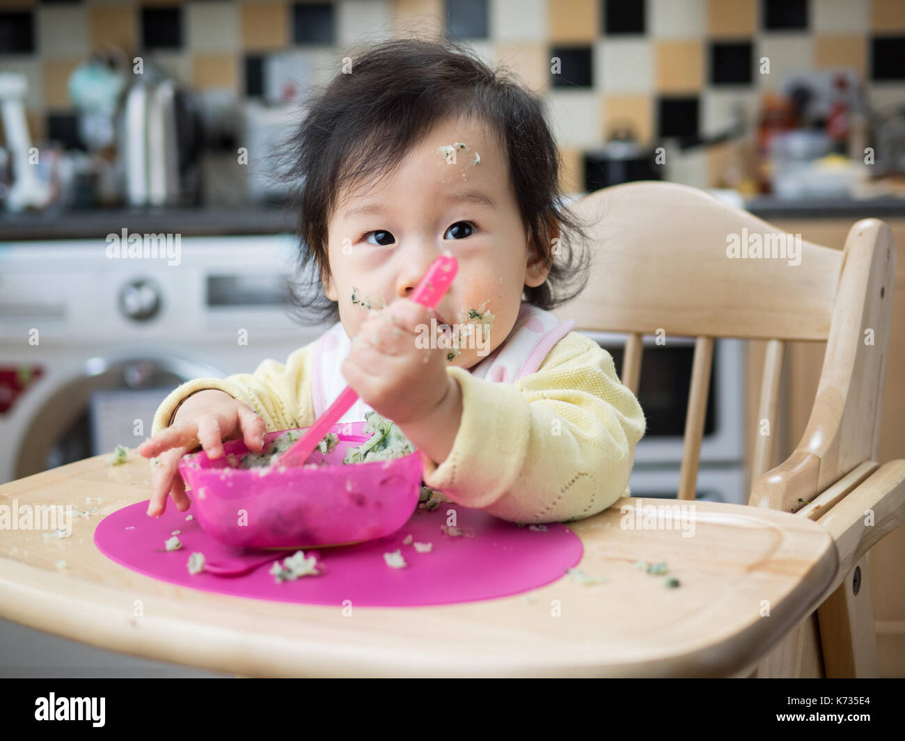 baby eating messy mashed potato Stock Photo - Alamy