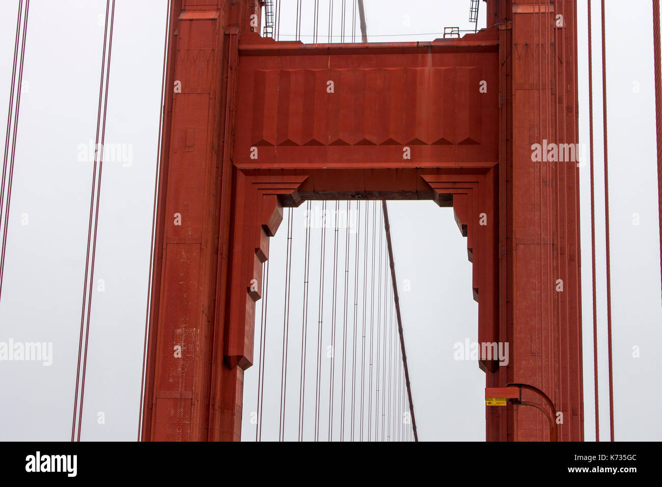 Details of the Golden Gate Bridge, a painted red suspension bridge ...