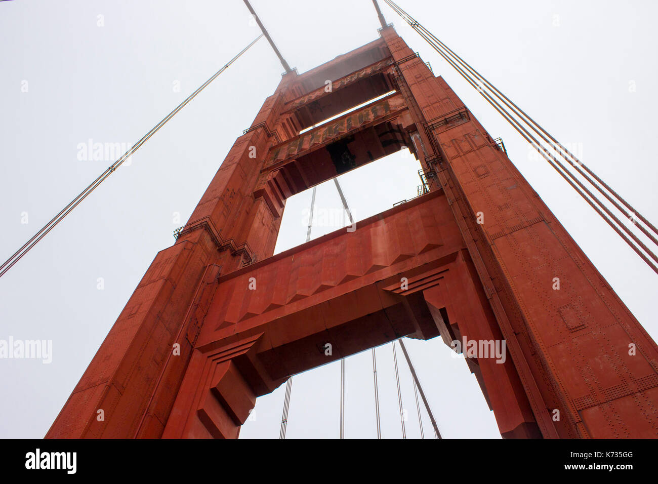 Details of the Golden Gate Bridge, a painted red suspension bridge ...