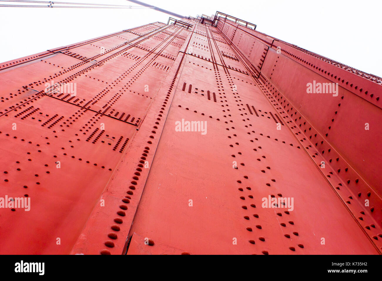 Details of the Golden Gate Bridge, a painted red suspension bridge ...