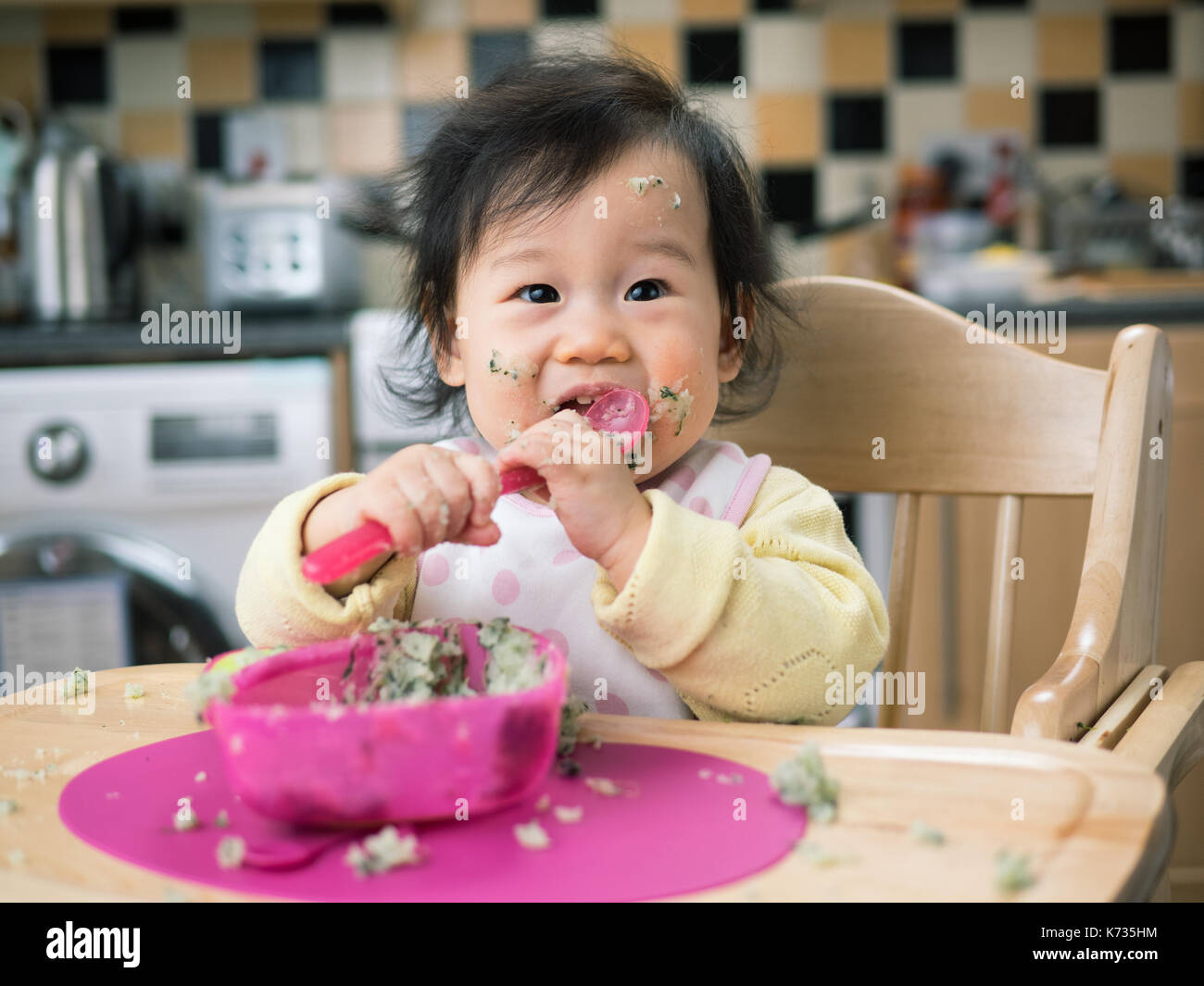 baby eating messy mashed potato Stock Photo - Alamy