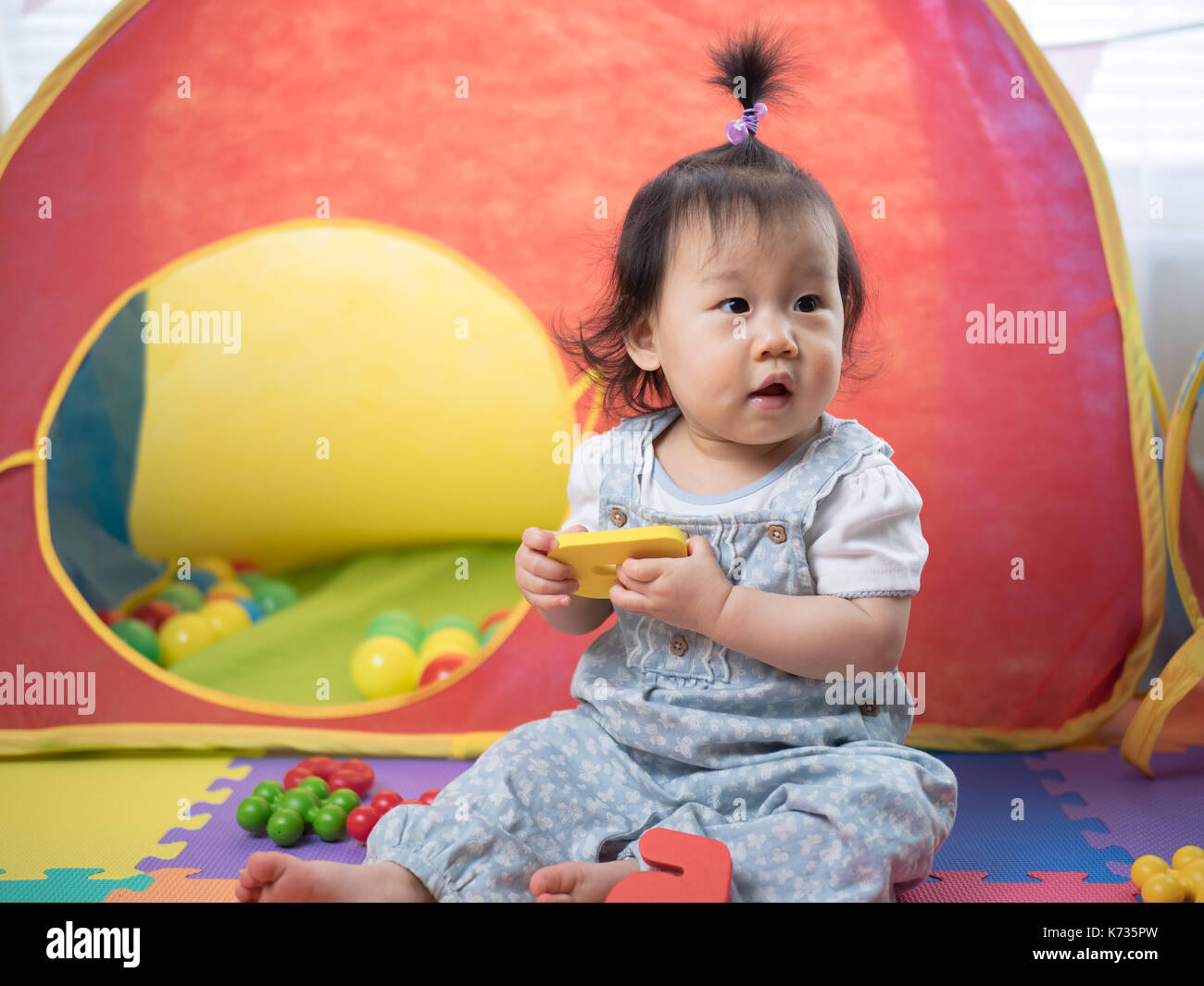 baby girl learning alphabet blocks Stock Photo - Alamy