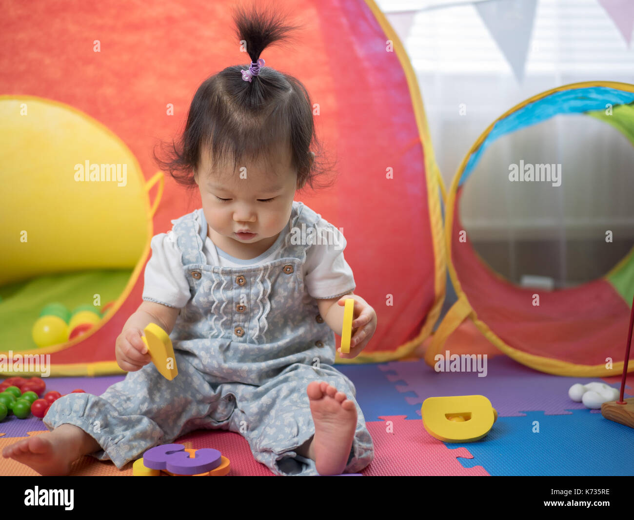baby girl learning alphabet blocks Stock Photo - Alamy