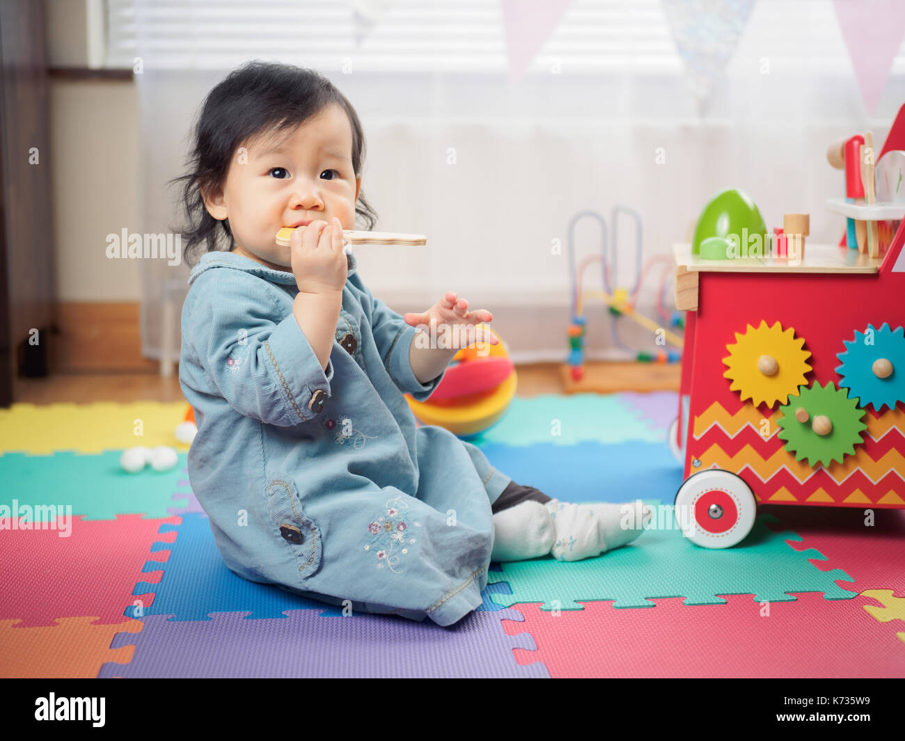 cute baby girl play toy at home Stock Photo - Alamy