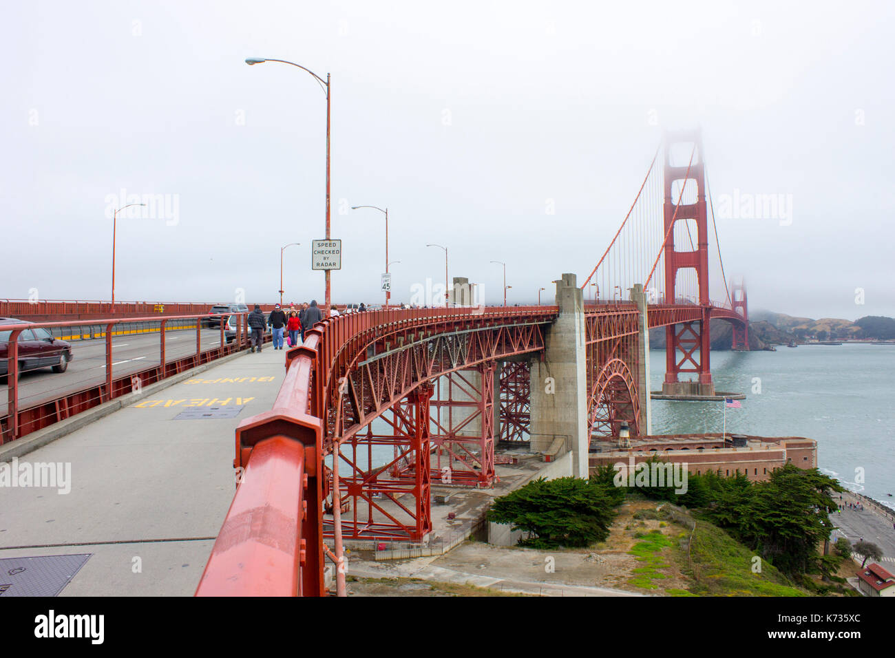 The Golden Gate Bridge, a painted red suspension bridge spanning the ...